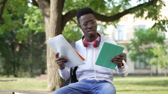 Zoom in to Stressed Overloaded Young Student Sitting on Bench with ...