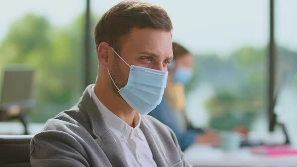 Man working on computer, face mask, Stock Footage | VideoHive