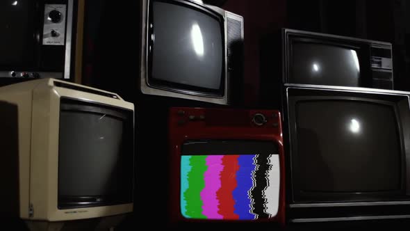 Retro TV Color Bars with Snow and Noise Over a Pile of Vintage TVs ...