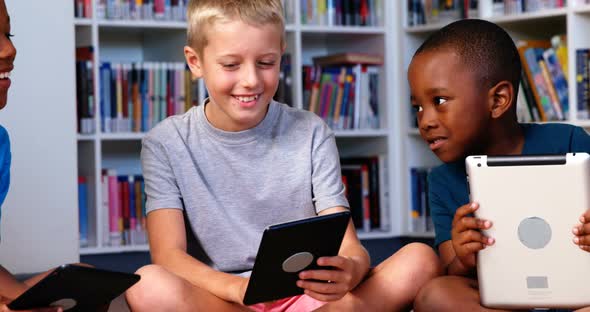 School kids using digital tablet in library, Stock Footage | VideoHive