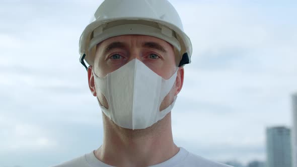 Portrait of an Advanced Worker Against the Backdrop of Large Tall ...