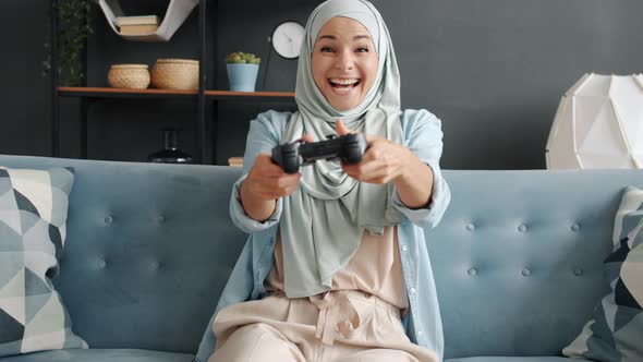Slow Motion Portrait of Happy Muslim Girl Gamer Playing Alone Enjoying ...
