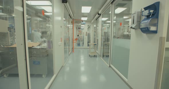 Scientists walking in halls of a pharmaceutical lab, Stock Footage