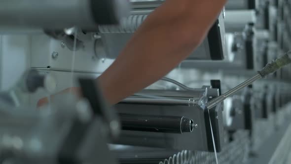 Operator Works on Polymer Thread Winding Machine, Stock Footage | VideoHive