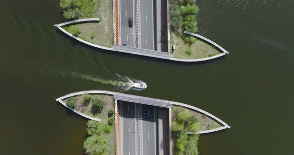 Aquaduct Veluwemeer water bridge with boat crossing above highway ...