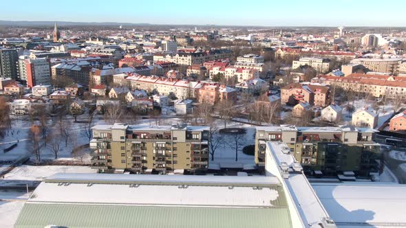 Drone shot of Orebro city in Sweden. Snow covered buildings in winter ...