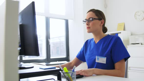 Tired Doctor with Computer Working at Hospital, Stock Footage | VideoHive