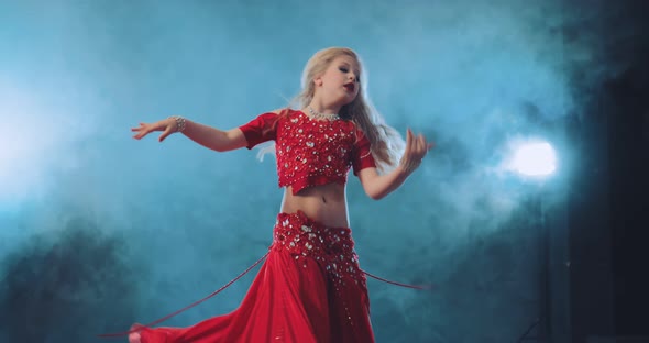 Beautiful Blonde Girl Doing Shaking Belly and Flowing Movements with ...