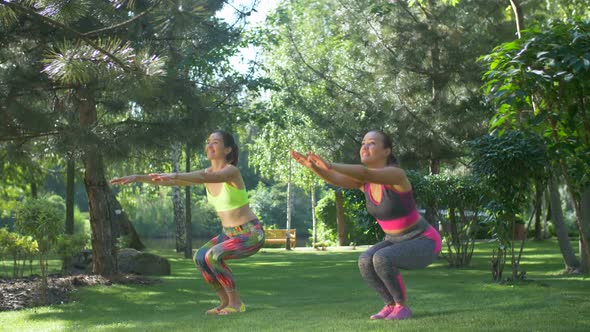 Pretty Sporty Fitness Women Doing Squats in Nature, Stock Footage ...