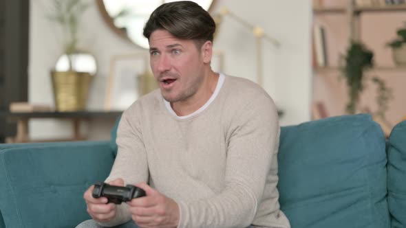 Middle Aged Man Playing Video Game at Home , Stock Footage | VideoHive