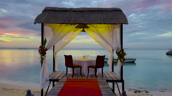 Romantic Evening Table for Two Persons on the Beach at Sunset on the ...