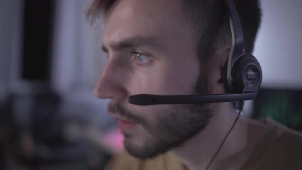 Face of Absorbed Nervous Gamer in Headset Playing Video Games Online ...