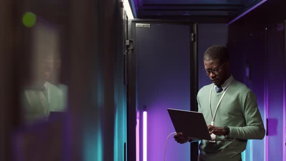 Young Man Maintaining Work of Mainframe, Stock Footage | VideoHive