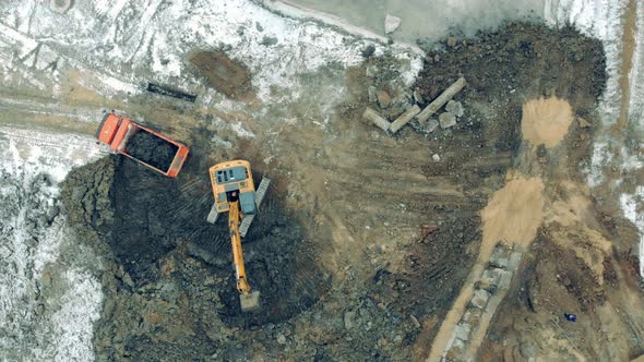 Modern Tractors Work at a Quarry, Digging Earth. Construction Excavator ...