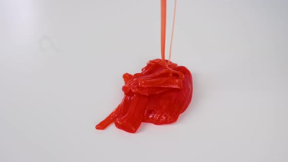 Red Slime Flowing Down on a White Background, Stock Footage | VideoHive