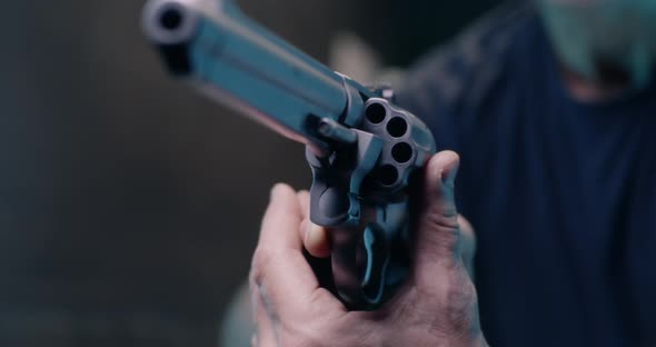 Unrecognizable Man Reloading Revolver in Shooting Range, Stock Footage