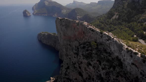 AERIAL: Cape Formentor viewing platform with cliff coast and sea on ...