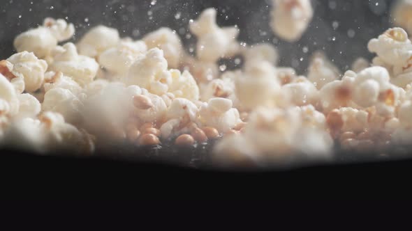 Popcorn popping on heated fry pan. Slow Motion., Stock Footage | VideoHive