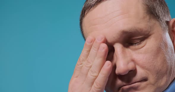 Person Touches Eye and Scratches Eyebrow with Fingers, Stock Footage