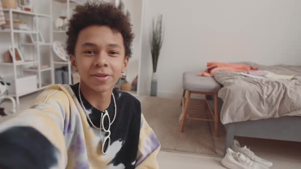 POV of Biracial Tween Boy Making Live Stream from Home, Stock Footage