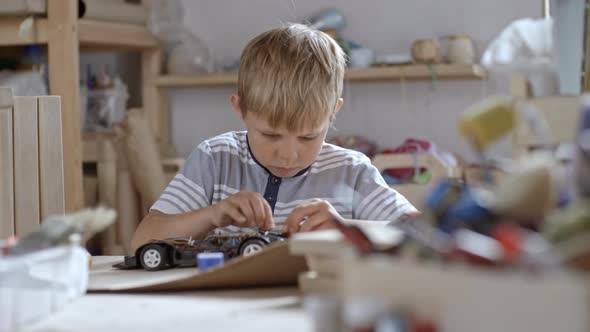 Boy Fixing Toy Car, Stock Footage | VideoHive