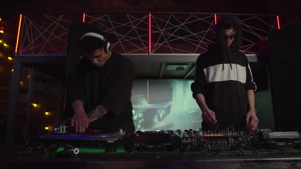 Modern Multiethnic Male Djs Performing Live Set Using Sound Mixer and ...