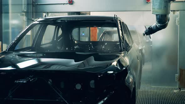 Factory Machine Is Spraying Zinc Over a Carcass of a Car, Stock Footage