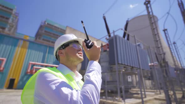 Engineer speaking by radio., Stock Footage | VideoHive