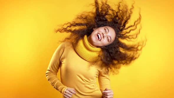 Young Cute Girl Dancing on Yellow Studio Background. Woman Colorful ...
