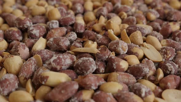 Tilting over Arachis hypogaea salted snack close-up 4K 2160p 30fps ...