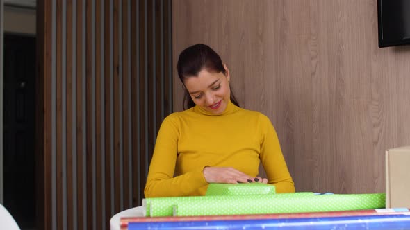 Girl at Home Fiddling with Gifts, Stock Footage | VideoHive