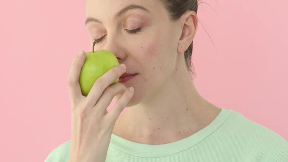 Beautiful Girl Enjoys Smell Apple, Stock Footage | VideoHive