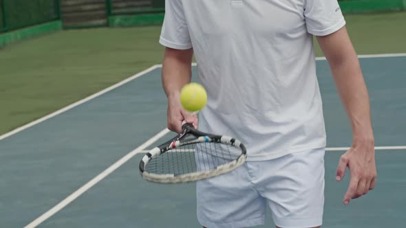Man Bouncing Tennis Ball on Racket at Court, Stock Footage | VideoHive