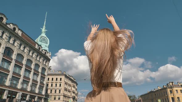 Blonde with Loose Hair Waved By Wind Poses Raising Hands, Stock Footage