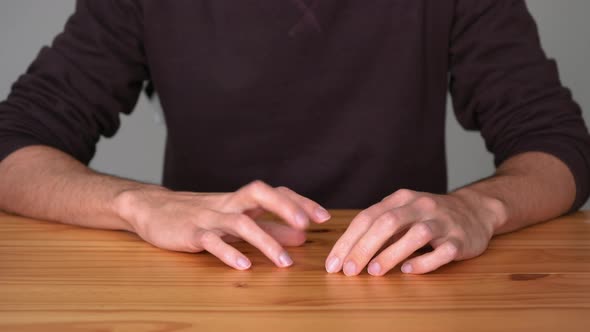 Bored Man Sitting And Tapping Fingers On Wooden Table. close up, Stock ...