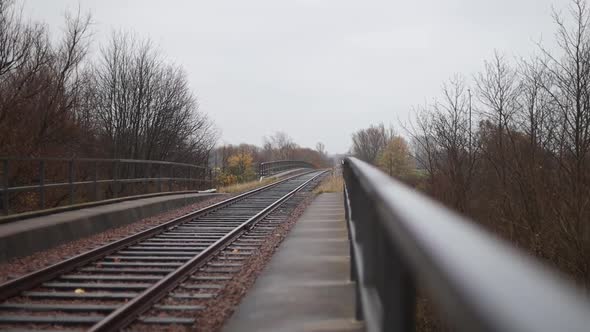 View of railroad, camera slowly moving away from railing, Stock Footage