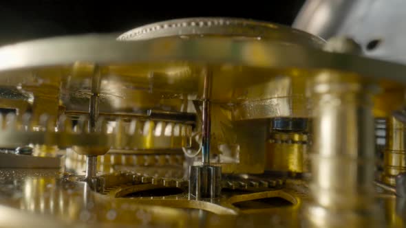 Inside View of a Moving Clockwork of Golden Mechanical Clock on Black ...