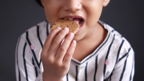 Child Eating Chocolate Cookies Close Up, Stock Footage | VideoHive
