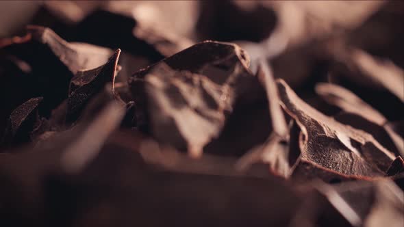 Chunks of sweet dark chocolate sliding backdrop, close-up. Gourmet ...