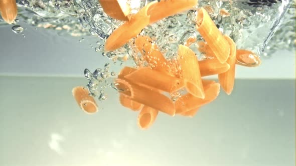 The Pasta Falls Into the Water with Air Bubbles, Stock Footage | VideoHive