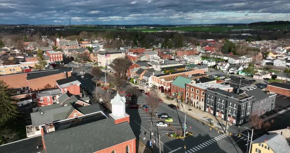Dramatic light and sky in small town America. Aerial establishing shot ...