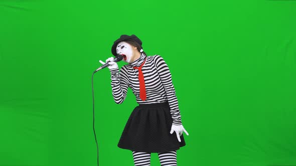 Mime Girl Singing a Song in Microphone, Dancing. Chroma Key, Stock Footage