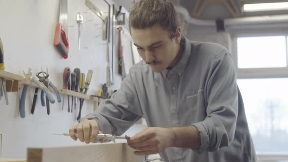 Carpenter Checking Thickness of Solid Wood Board with Calipers, Stock ...