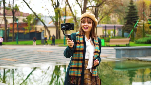 Pretty Girl Vlogger Using Steadicam and Smartphone for Live Streaming ...