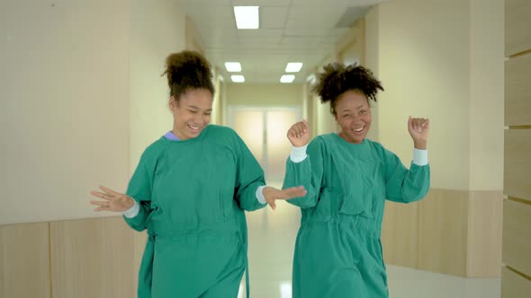 Team of doctors, nurses and assistants dancing after successful do ...
