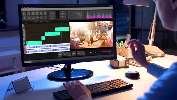 Editor Working on Video File on Computer at Night 6, Stock Footage