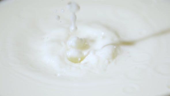 Extreme close up of a milk drop falling, Ultra Slow Motion, Stock Footage