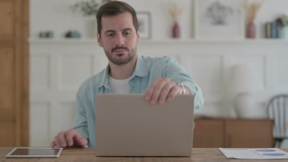 Young Man Closing Laptop After Work and Leaving Desk, Stock Footage