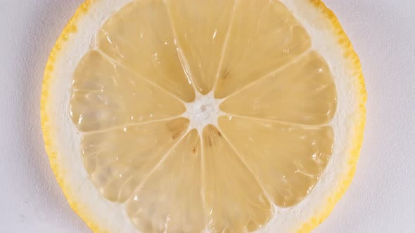 Macro Shot of Slice Lemon Fruit and Rotate, Stock Footage | VideoHive