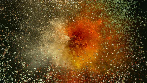 Super Slow Motion Shot of Colorful Seasoning Explosion on Black ...